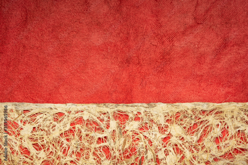 Amate bark paper with lace design against red huun paper. This ancient ...