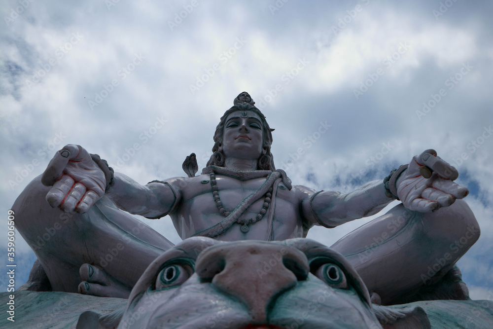 RISHIKESH, INDIA , Statue of Shiva, Hindu idol near Ganges River water ...