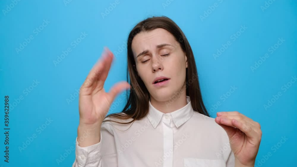 Close up portrait of boring tired young woman posing showing blah blah ...