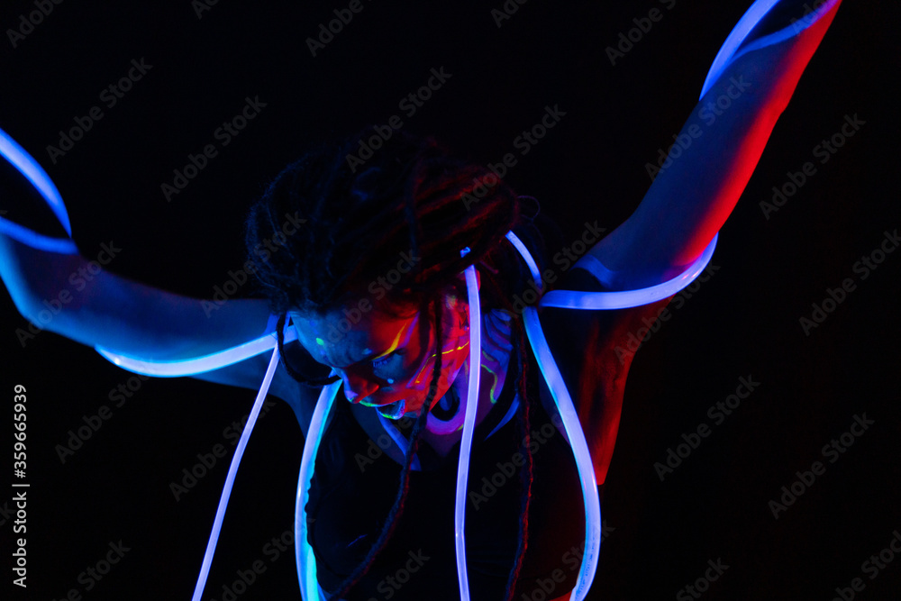 Portrait of a Warror Girl with Glowing Tubes in Neon UF Light. Model ...