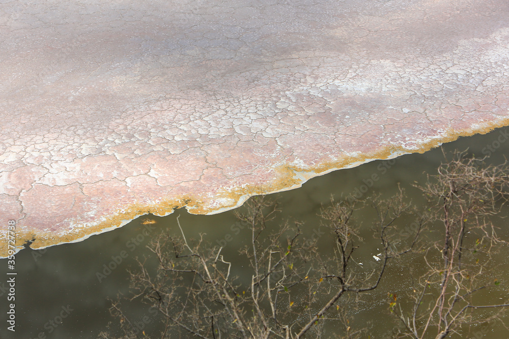 Aerial view of the salt pan and mineral crust with red algae of Lake ...