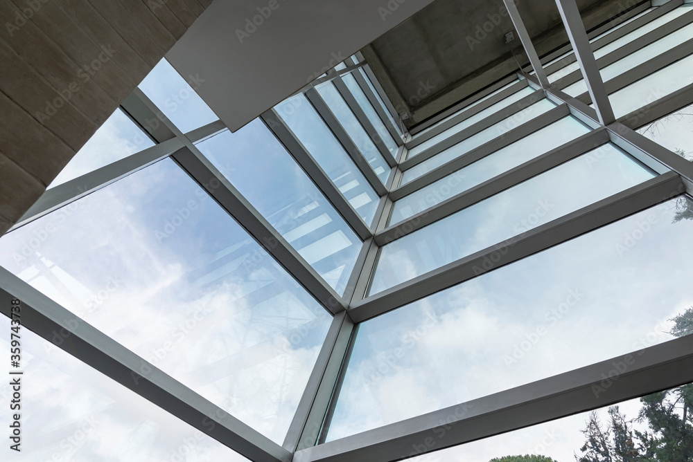Transparent glass skylight in building walls Squared windows in an ...