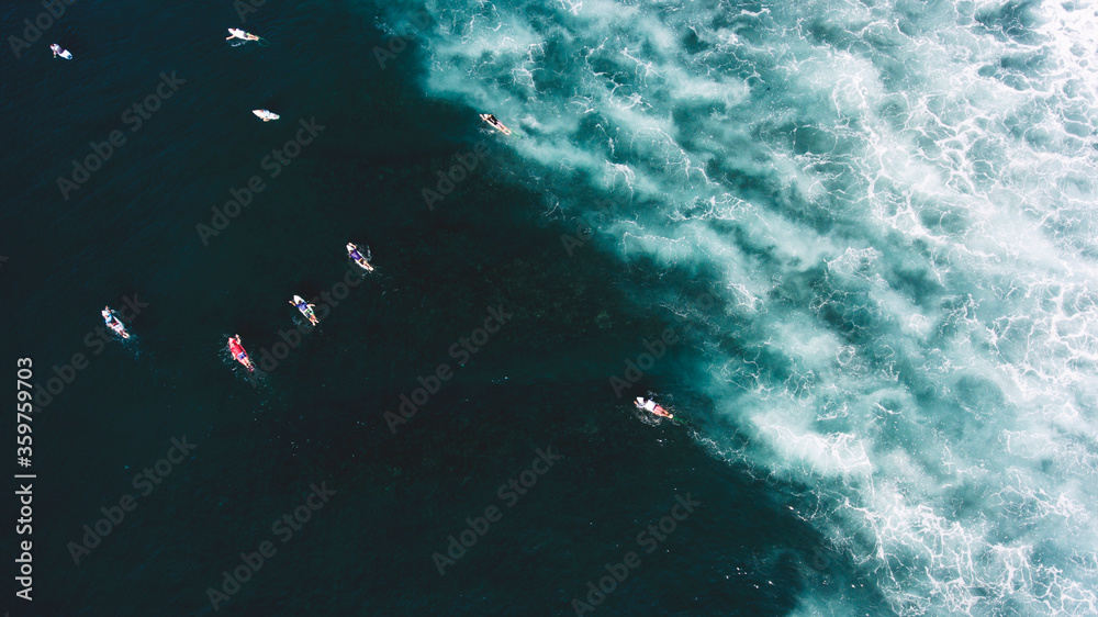 Top view aerial photo from drone of a group of professional surfers ...
