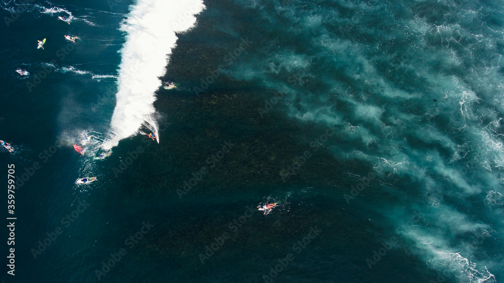 Top view aerial photo from drone of a swimming group with surfers in ...