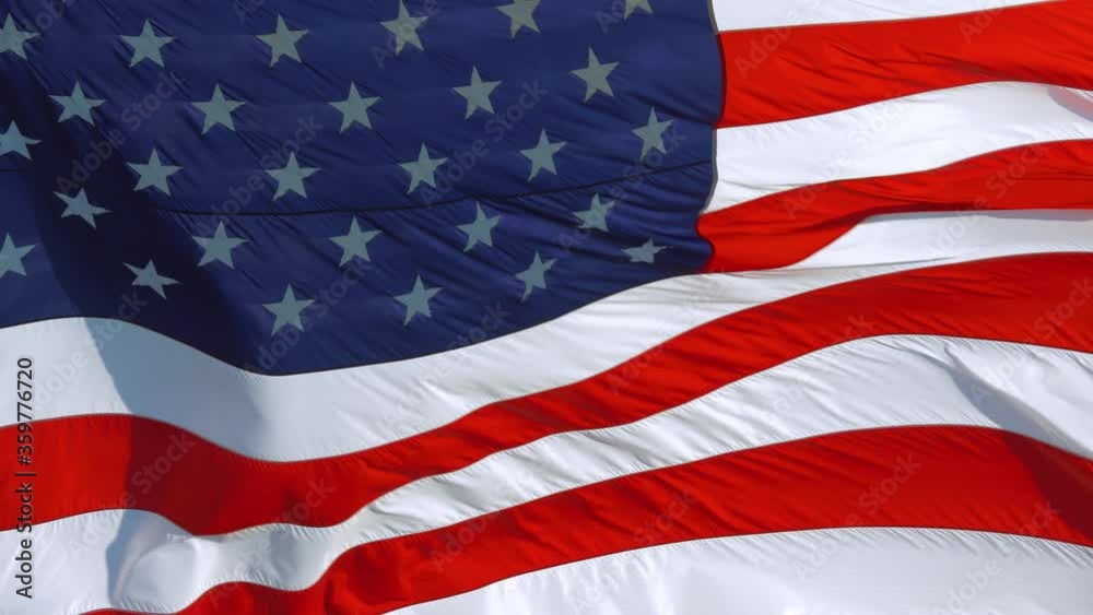 American Flag Waving, background close up. Large American Flag flies ...