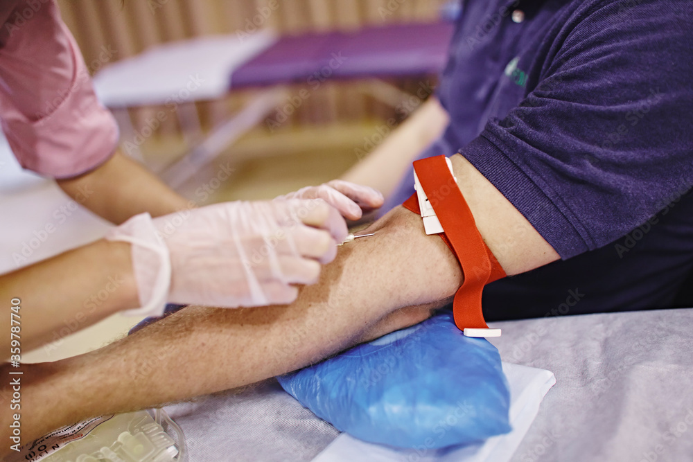 Blood sample. World blood donor day. Close up of a doctor drawing a ...