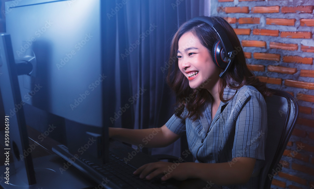 Asian Gamer girl woman nerdy geek casual playing video games computer ...