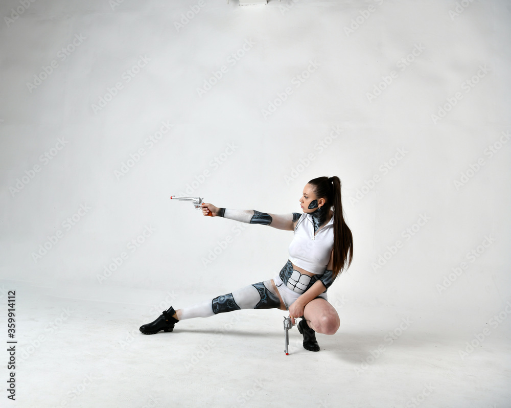beautiful girl in robot clothes posing with silver revolvers Stock ...
