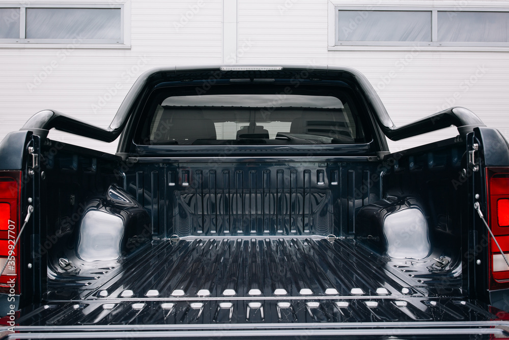 Pickup car with open trunk door ready to loading at the industrial park ...