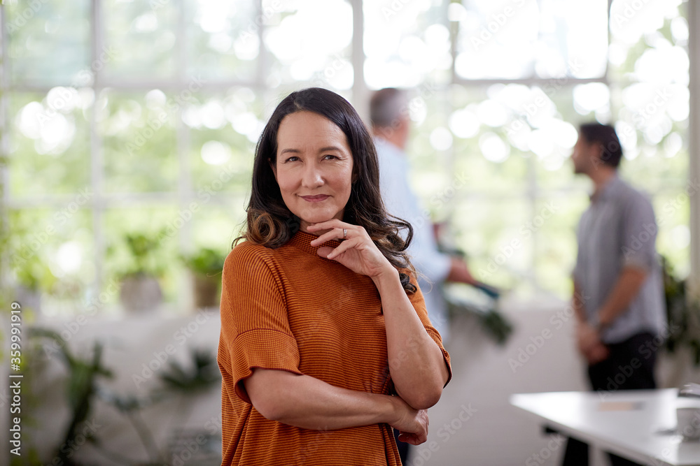 Professional business woman standing thinking in a studio office Stock ...
