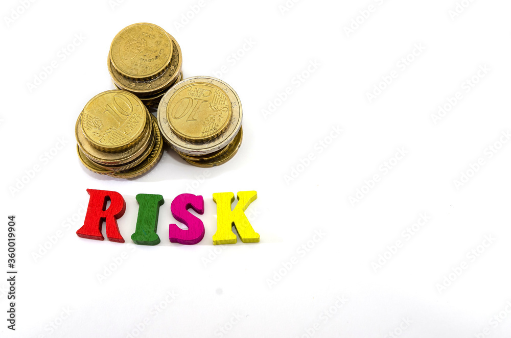 RISK word made of letters, stacks of coins isolated on white. Copy of ...