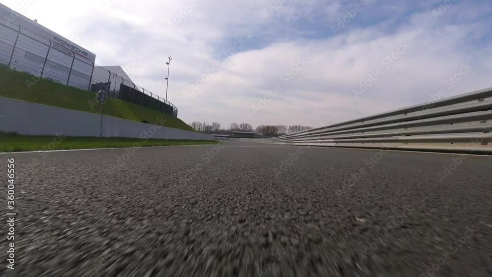 Point of view race car exiting the pit lane onto the circuit, front of ...