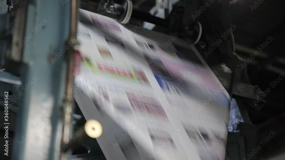 Paper speeds through printing press to produce Chinese language ...