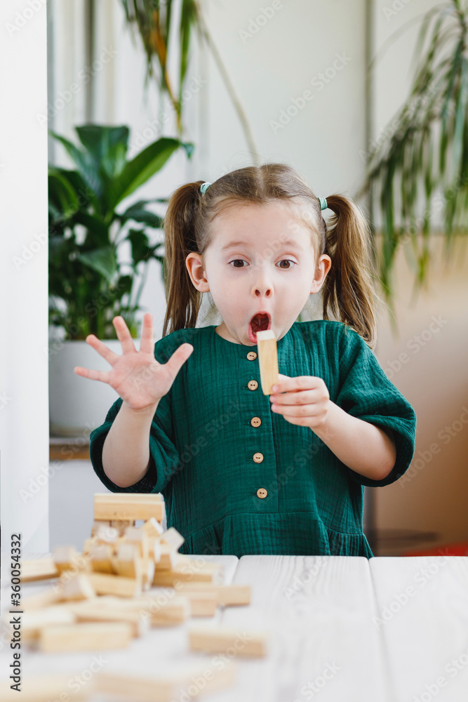 Preschool age girl expressive reaction on unexpected falling of wooden ...
