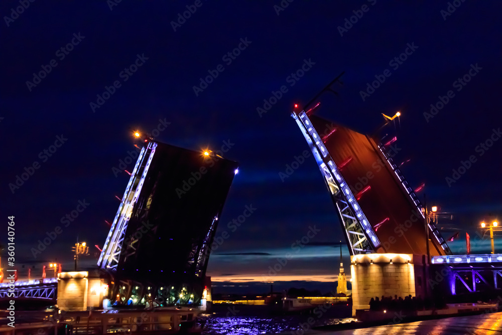 Opening of Palace drawbridge. Night view of Palace bridge from the Neva ...