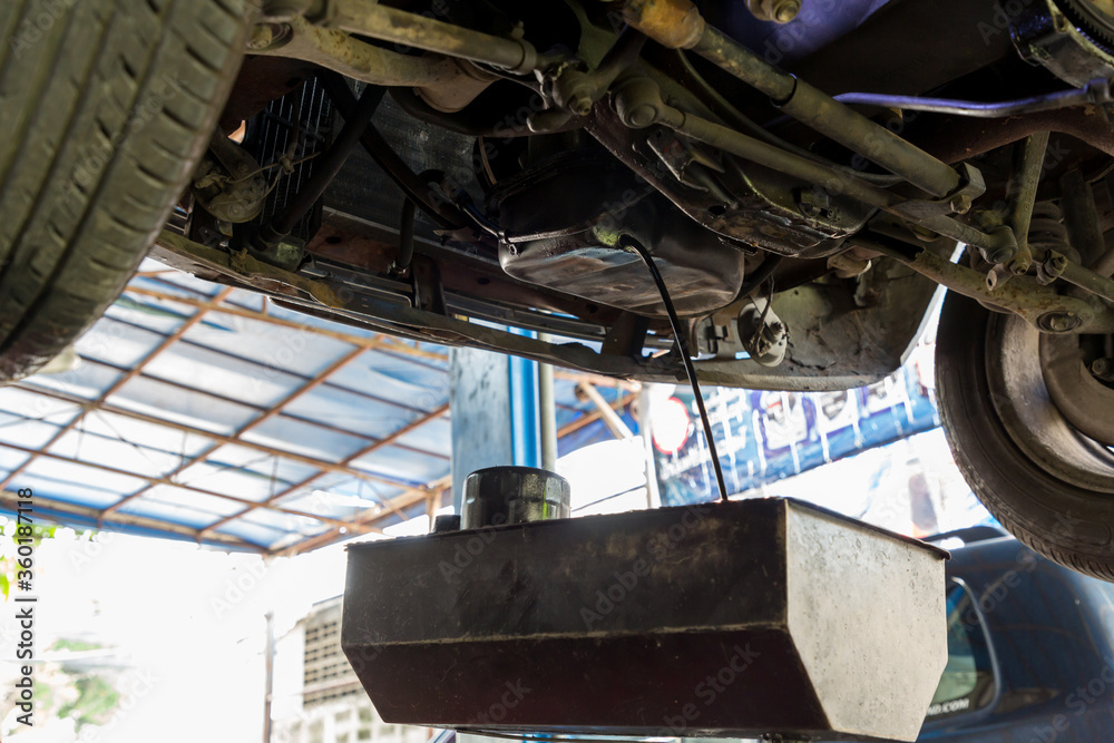 Drain the old oil from the engine through the drain plug. Changing the ...