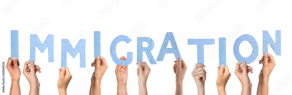 People holding word IMMIGRATION made of cardboard letters on white ...