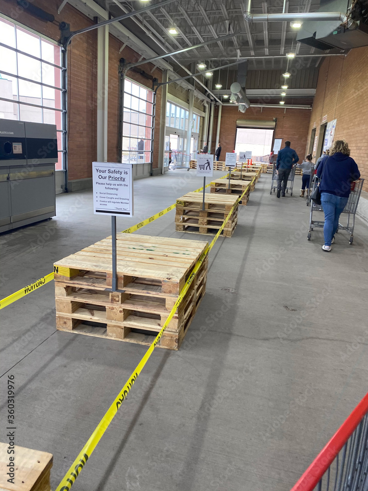 Foto de Social distancing protocol people with shopping carts grocery ...