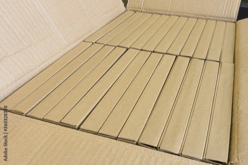 Lot of brown rectangular carton cardboard boxes stacked in one big box ...