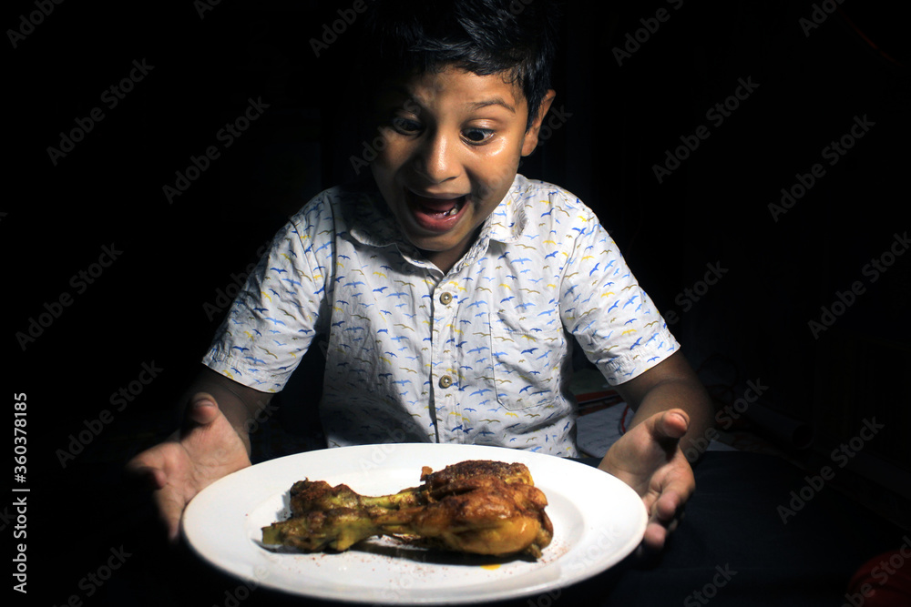 Child with yummy chicken roast. Child having a chicken drumstick to eat ... Child with yummy chicken roast. Child having a chicken drumstick to eat ...