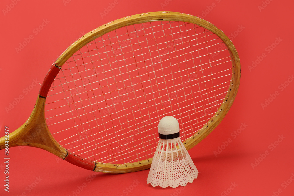 badminton racket and shuttlecock on a bright red background Stock Photo ...
