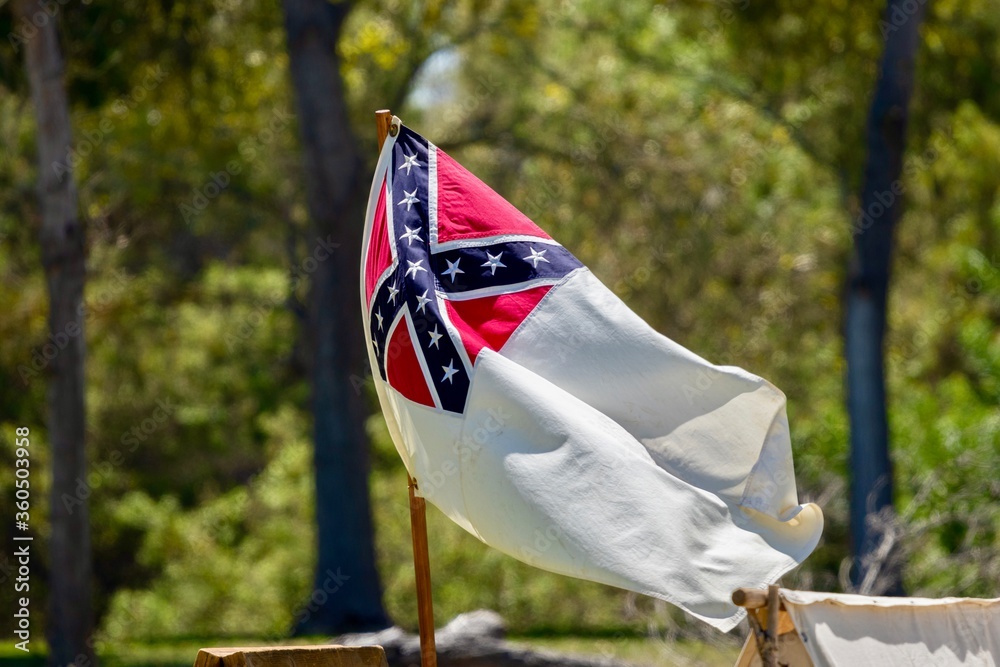 The confederate flag flying over a campsite at a American Civil war ...