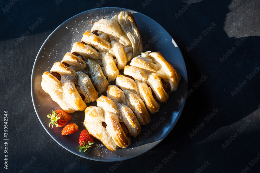Chocolate puff pastry. Home baked dark chocolate sweet pie on black ...