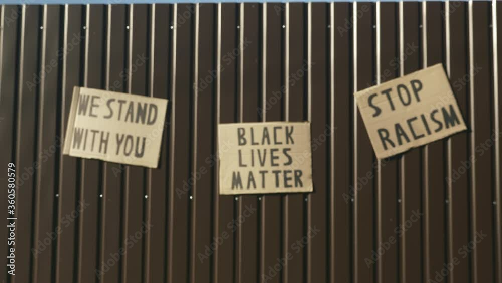 Posters BLACK LIVES MATTER, WE STAND WITH YOU, STOP RACISM on brown ...