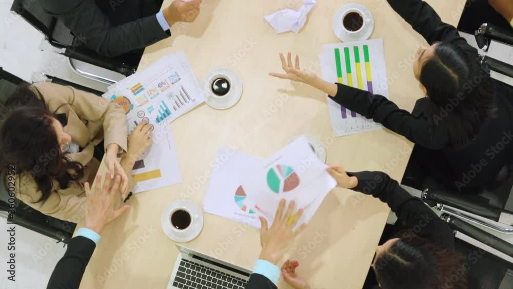 Angry business people with big problem at meeting table, shot top view ...