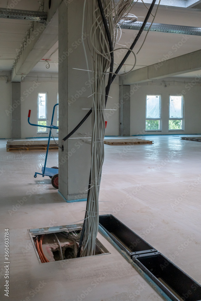 on construction site of a factory building the thick cable harnesses ...