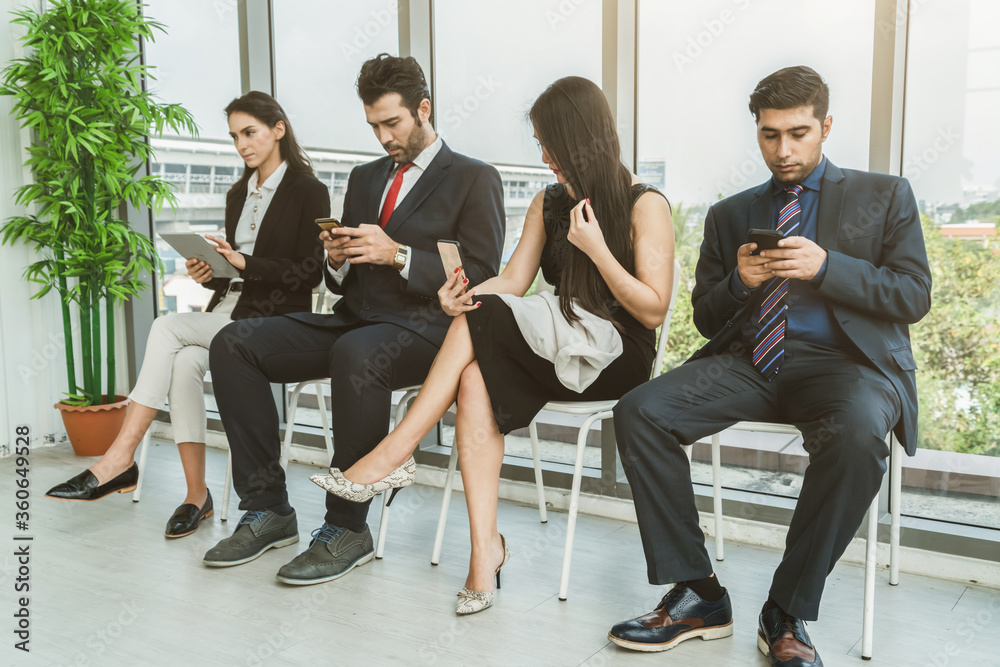 Job seekers and applicants waiting for interview on chairs in office ...