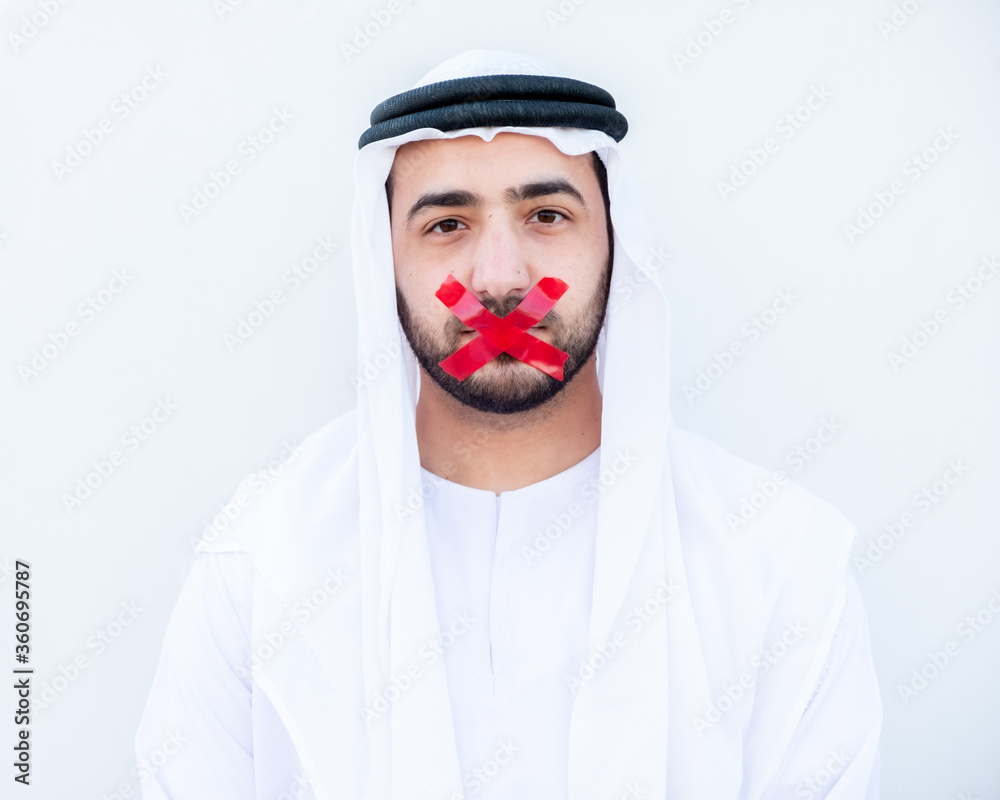 Arabic guy putting tape on his mouth as a symbol of mute foto de Stock ...