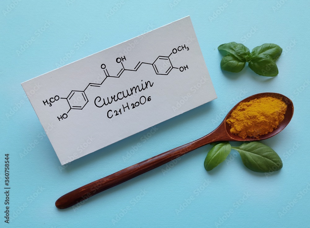 Structural chemical formula of curcumin molecule with wooden spoon ...