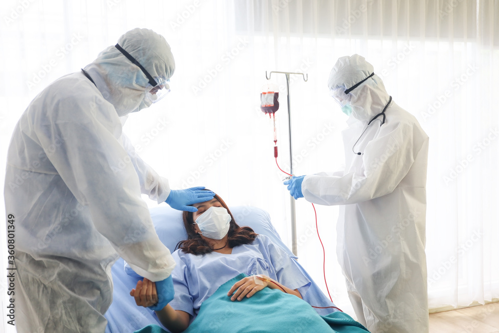A patient woman wear face mask and cure on bed and covid-19 emergency ...