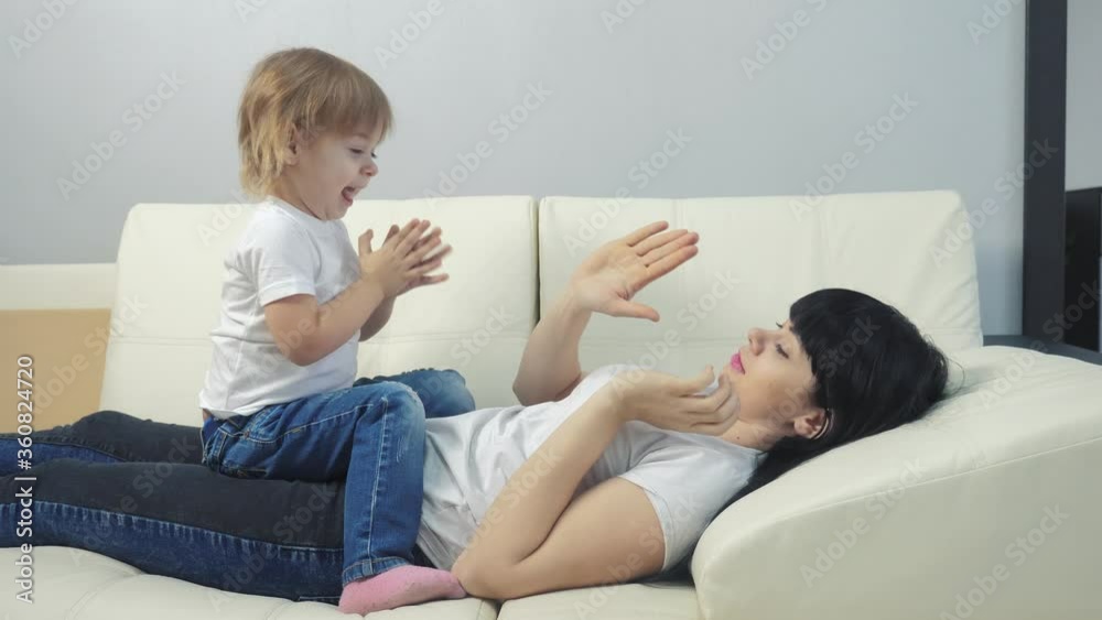 happy family concept. mom and daughter clap their hands. mother a and ...