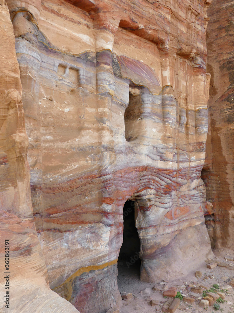 Royal tombs in the spectacular layers of multi-coloured sandstone rock ...