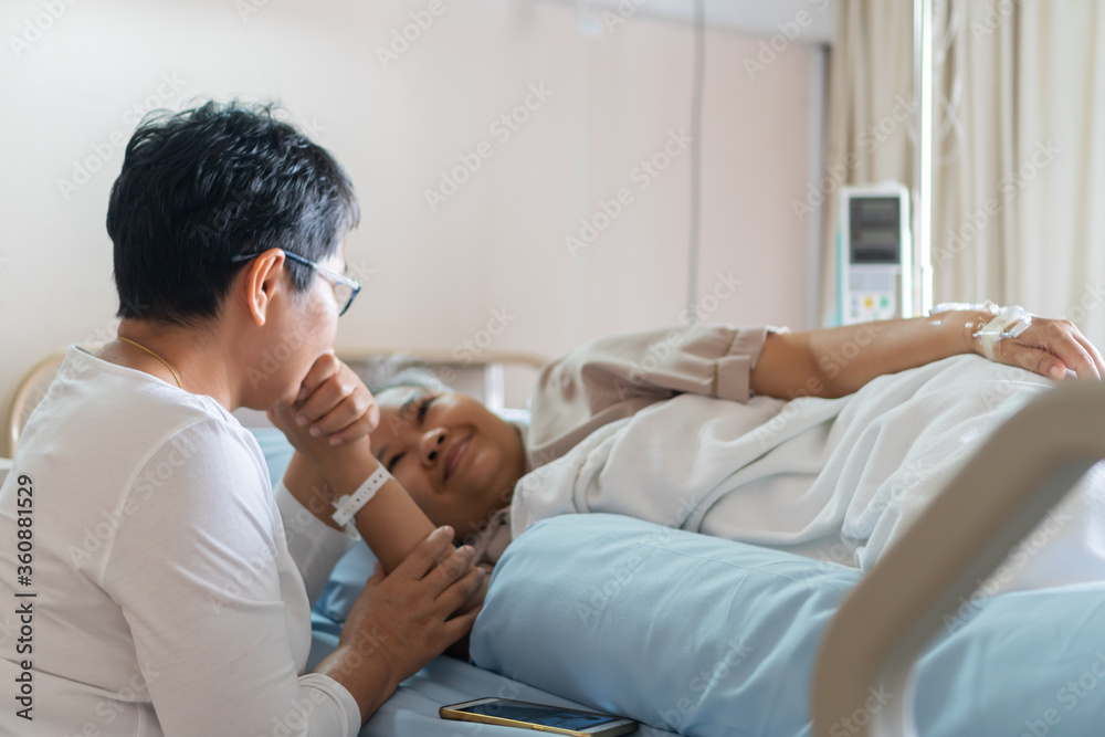 Happy Woman Visits Best friends holding hands for recovering that sick ...