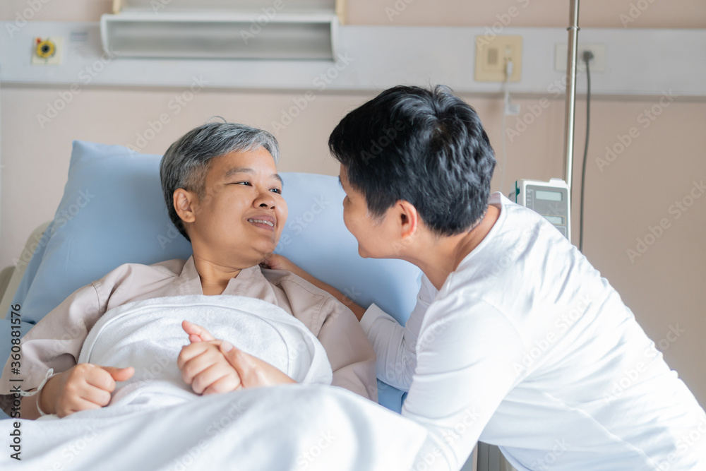 Happy Woman Visits Best friends holding hands for recovering that sick ...