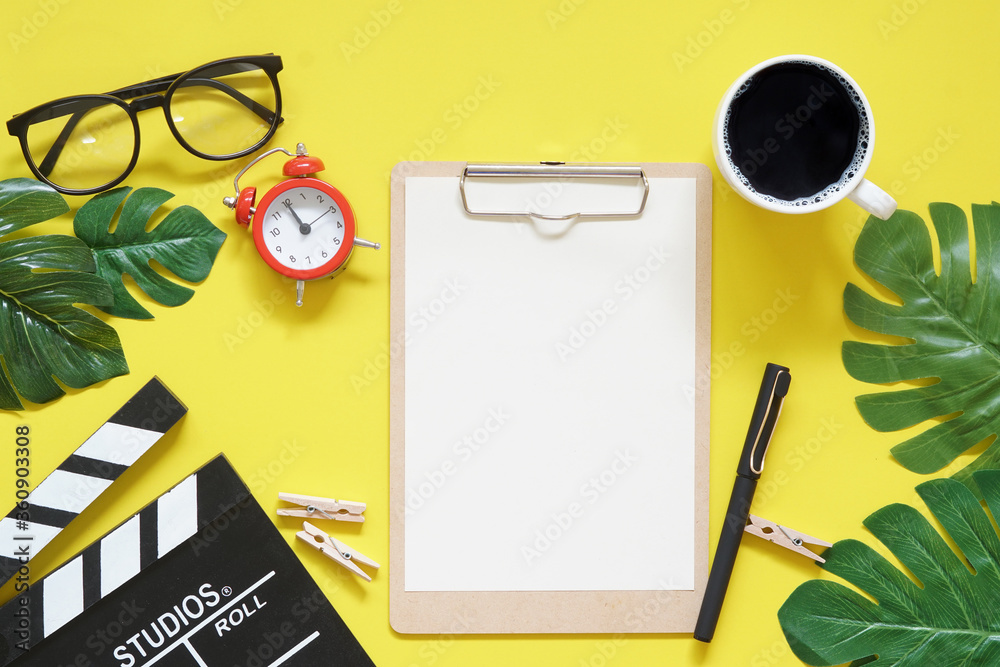 Vintage red clock in coffee time on filmmaker office table top view ...