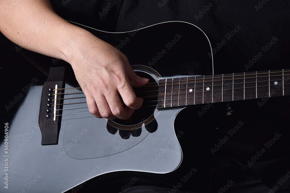 Professional musician playing acoustic guitar in music recording studio ...