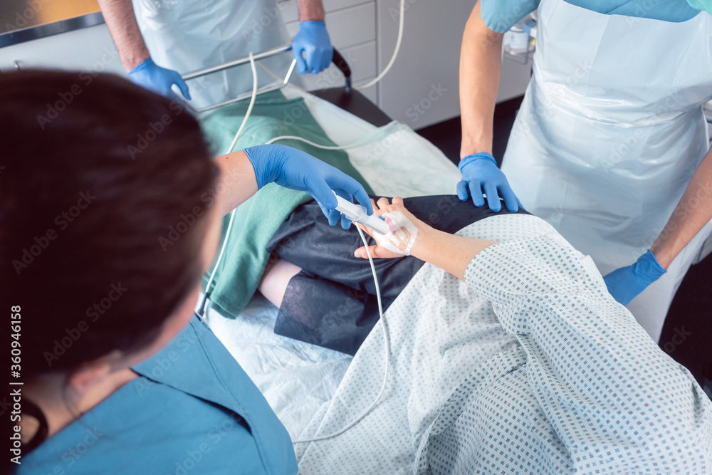 Team of doctors and nurses performing colonoscopy Stock Photo | Adobe Stock