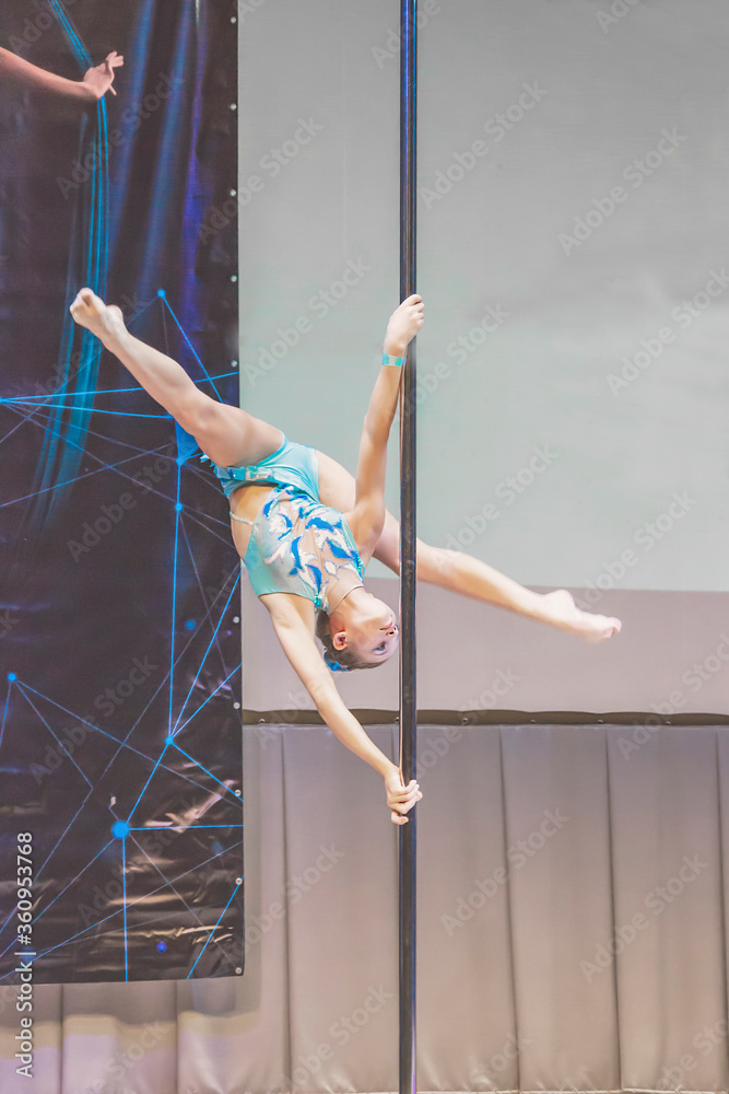 Picture of girl in light blue costume is showing acrobatic ticks on ...