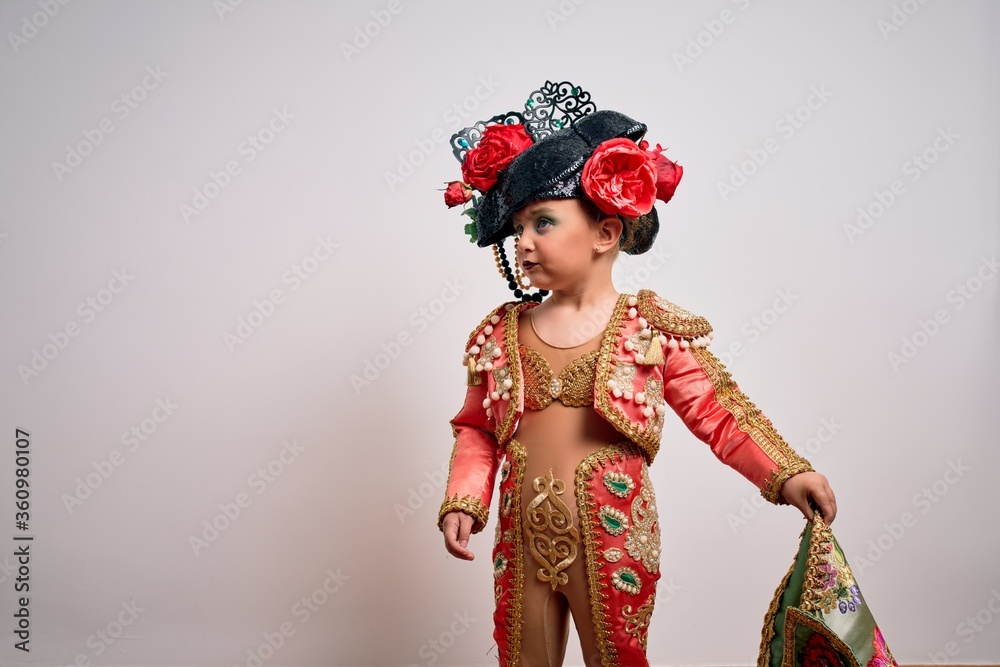 Young little caucasian kid girl wearing bullfighter traditional folkore ...