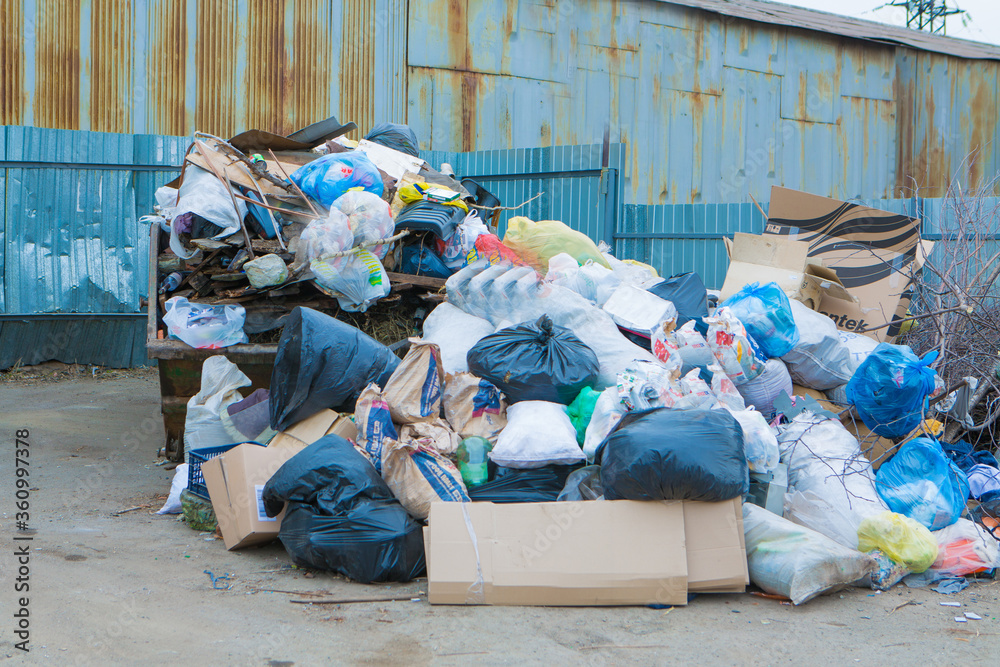 pile of waste in a container. garbage collapse. Janitors ' strike ...