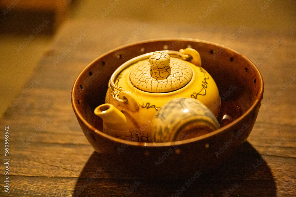 Vietnam tea in a small traditional pot served in a cafe in Hanoi ...