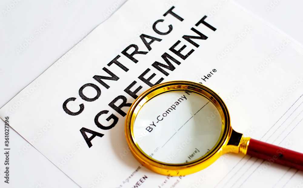 Magnifying Glass and document CONTRACT close up Stock Photo | Adobe Stock