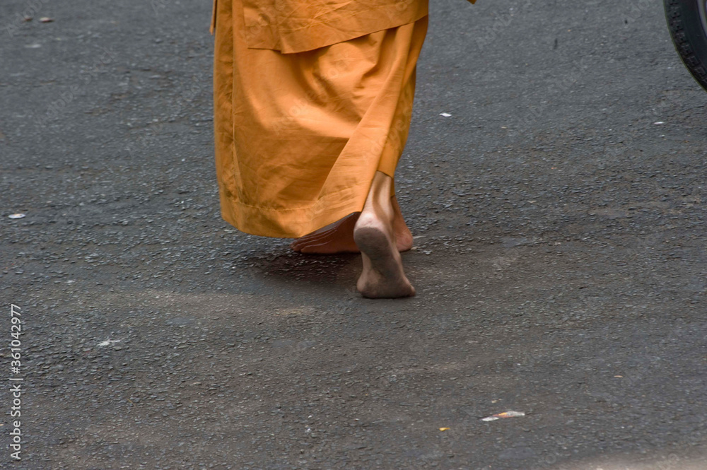 zen monk walking barefoot in the streets of vietnam Stock Photo | Adobe ...