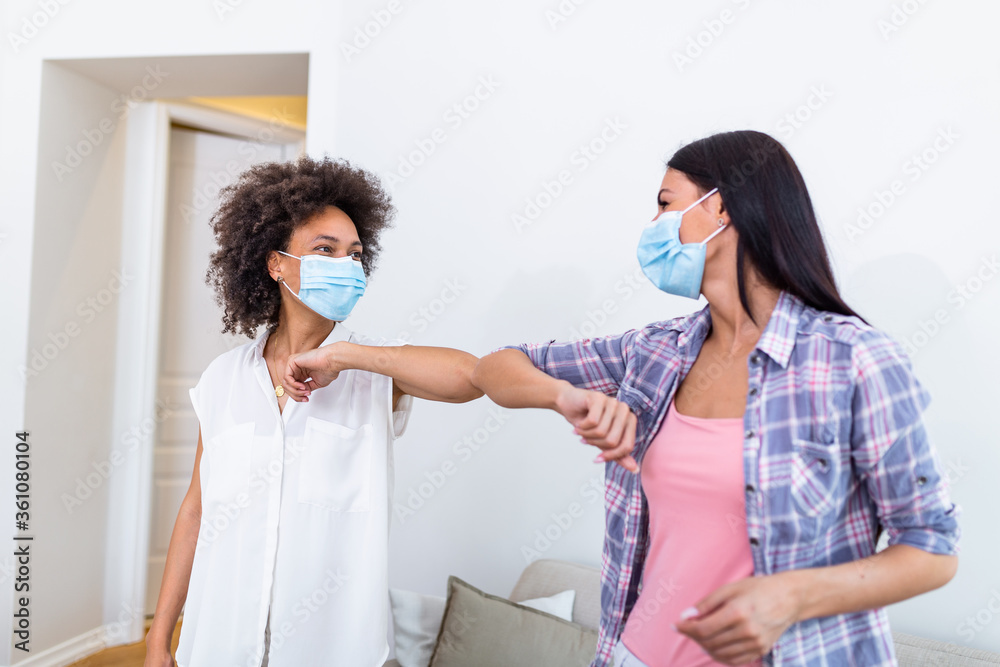 Friendly smiling millennial diverse female colleagues keeping social ...