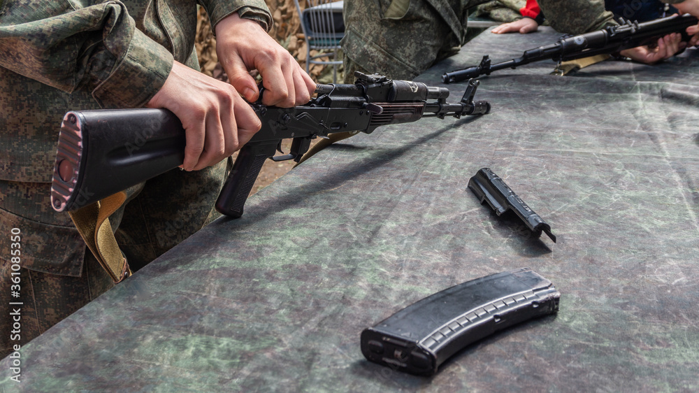 Military Soldier Is Training How To Disassemble Rifle AK-47 Stock Photo ...