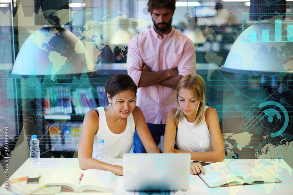 Group of university students learning together on laptop computer in ...